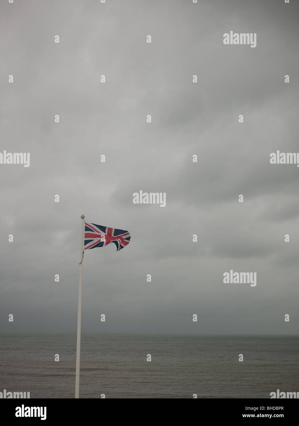 Union flag with sea in background Stock Photo - Alamy