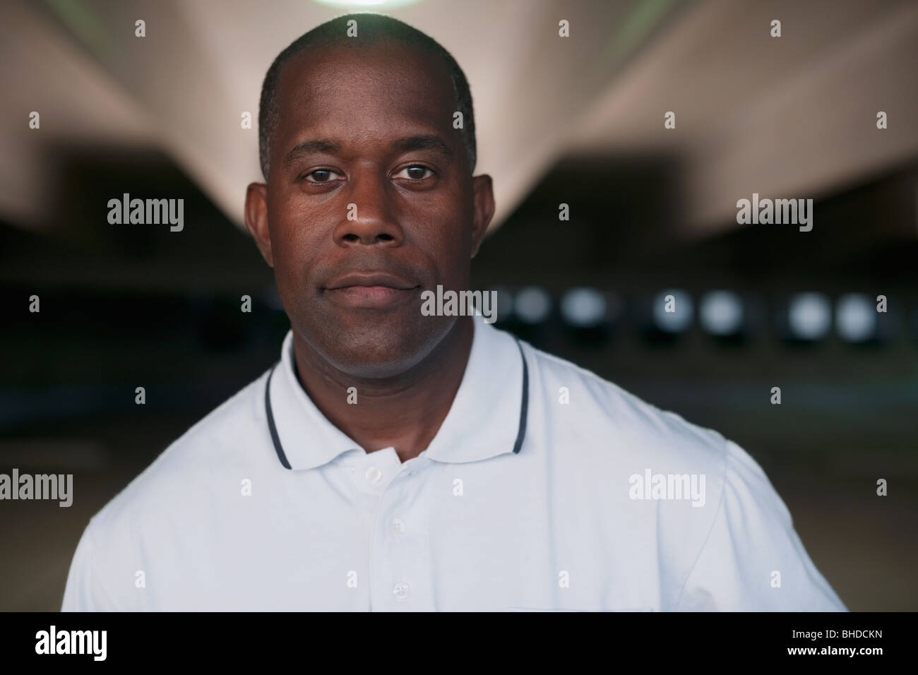 African man standing in parking garage Stock Photo - Alamy