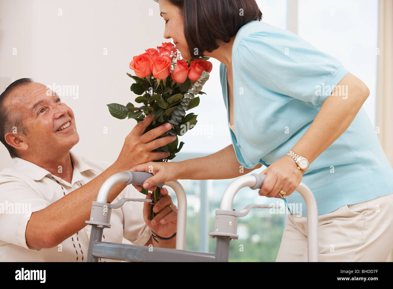 Hispanic man bring wife flowers Stock Photo - Alamy