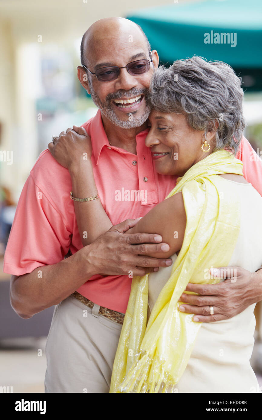 African couple hugging Stock Photo - Alamy