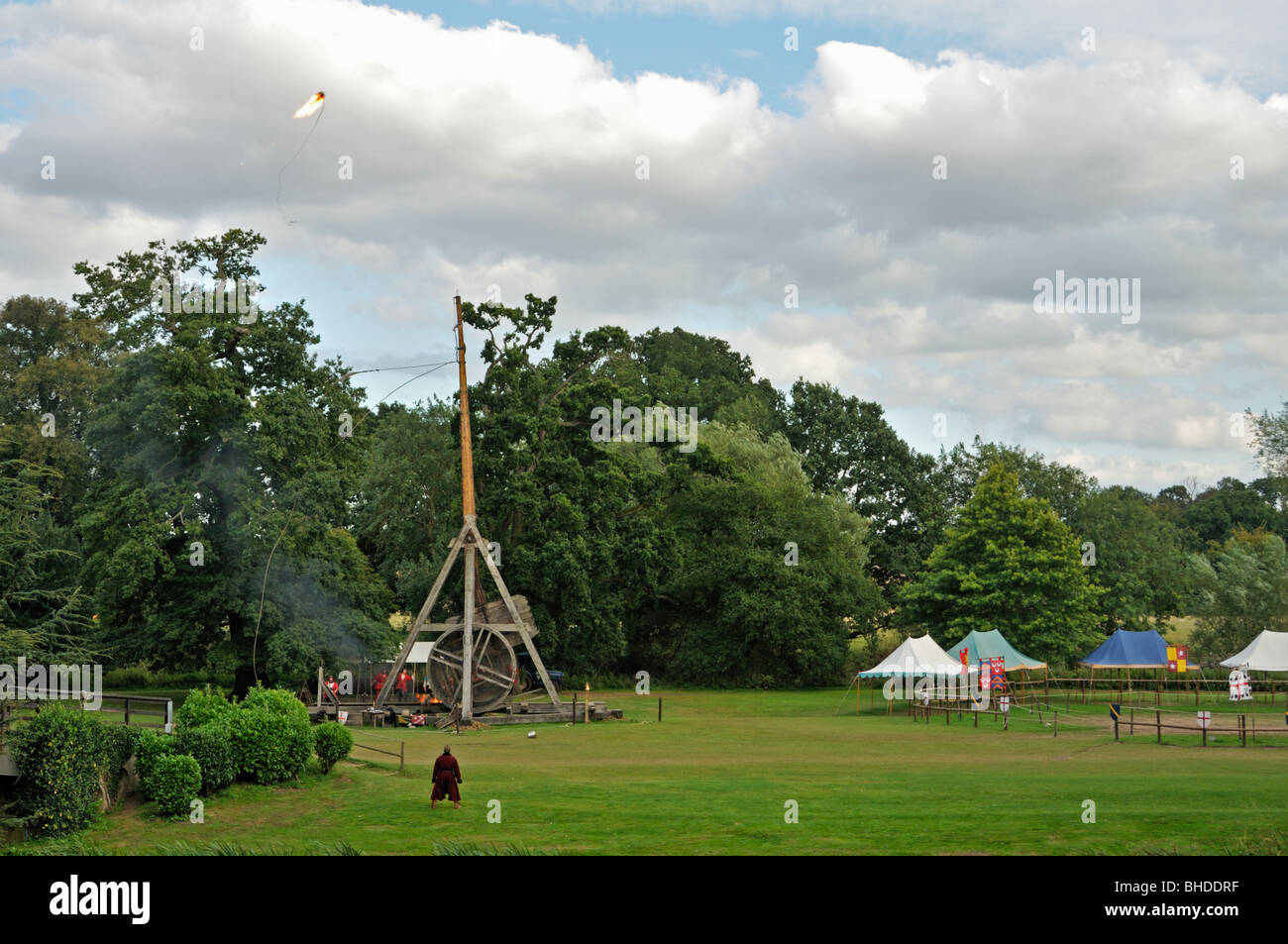 A burning projectile thrown by a replicate wooden trebuchet, sequence 3 ...
