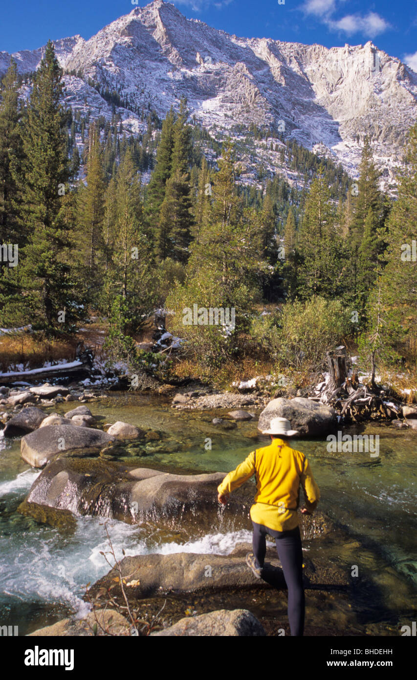 Man crossing river Stock Photo - Alamy