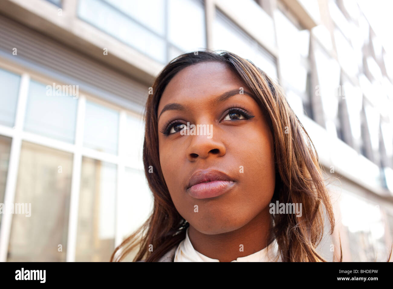 African woman looking pensive Stock Photo - Alamy