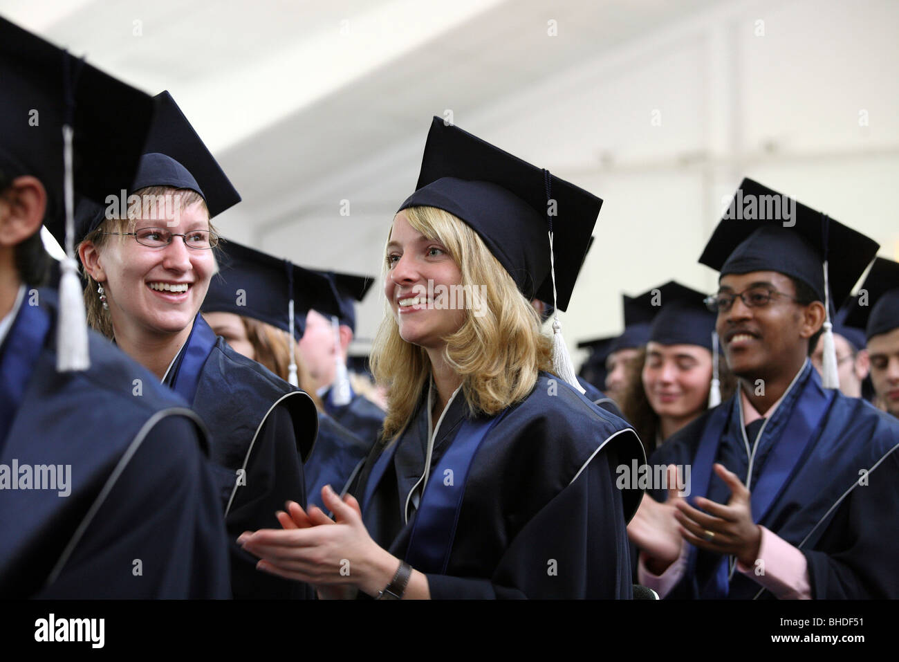 College students clapping in graduation hi-res stock photography and ...