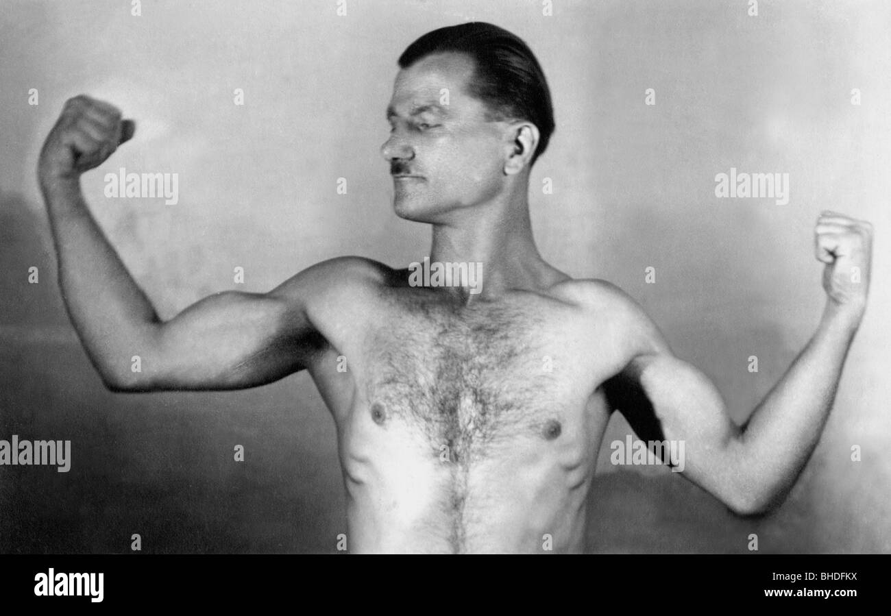 people, men, musclemen, man showing his muscles, 1930 Stock Photo - Alamy