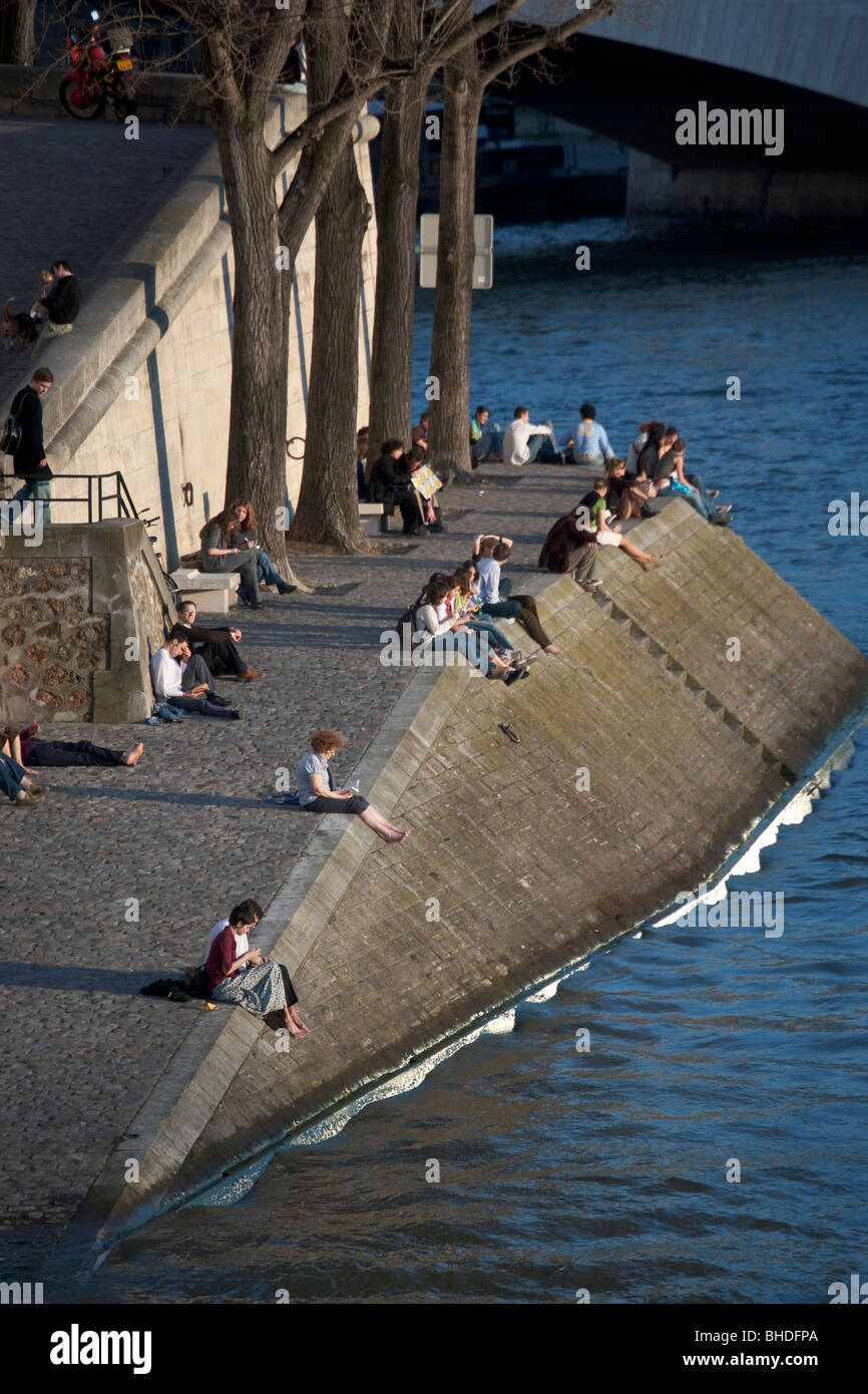 People sunning on banks of Seine, Paris, France Stock Photo - Alamy