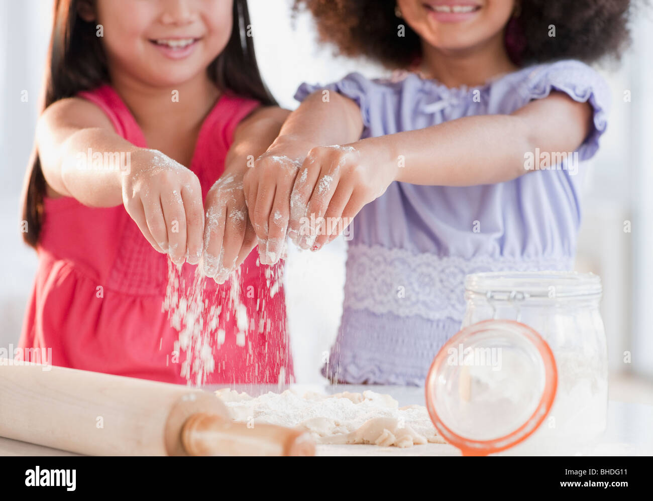 Girls baking together Stock Photo - Alamy
