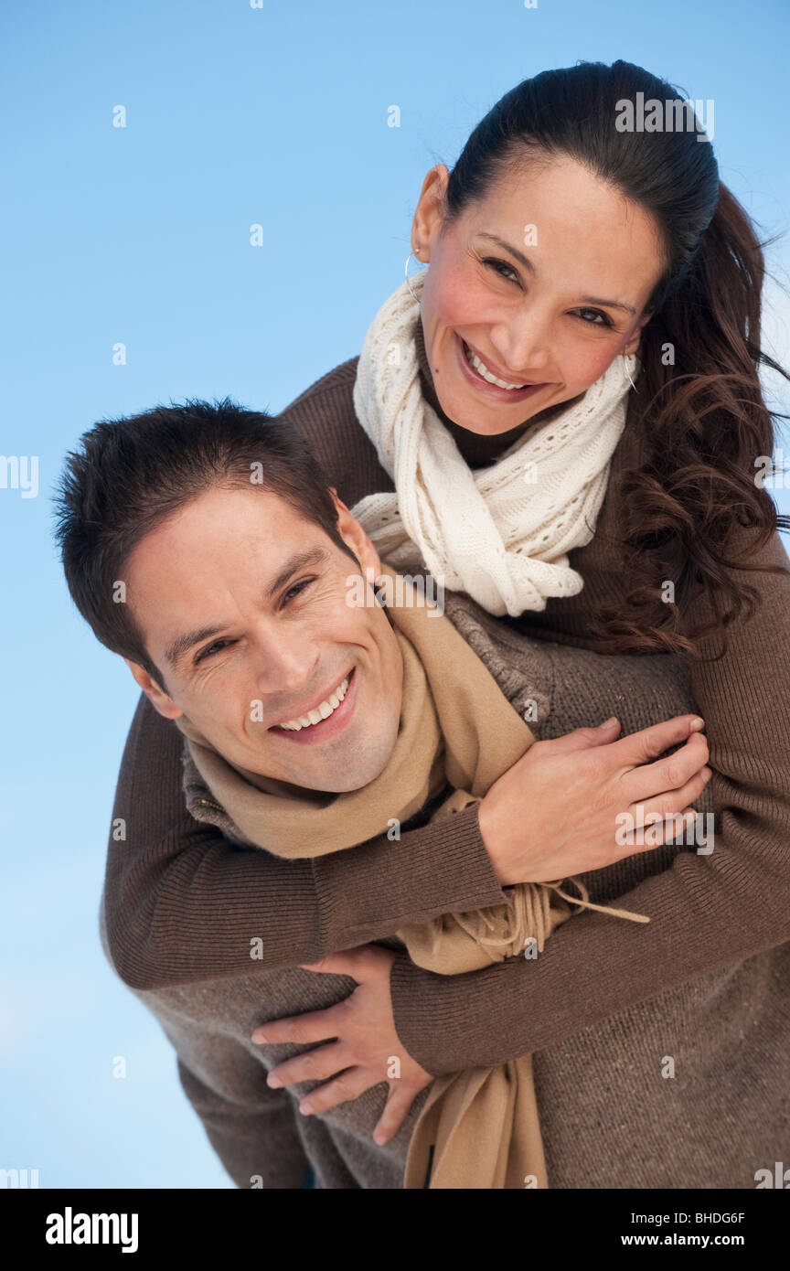 Hispanic couple hugging Stock Photo - Alamy