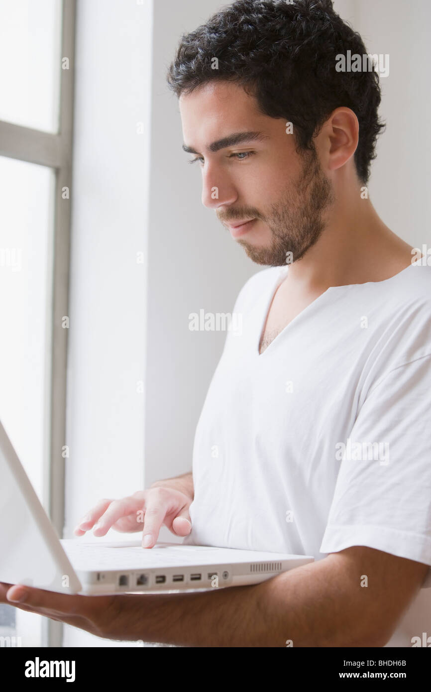 Hispanic man beard typing hi-res stock photography and images - Alamy