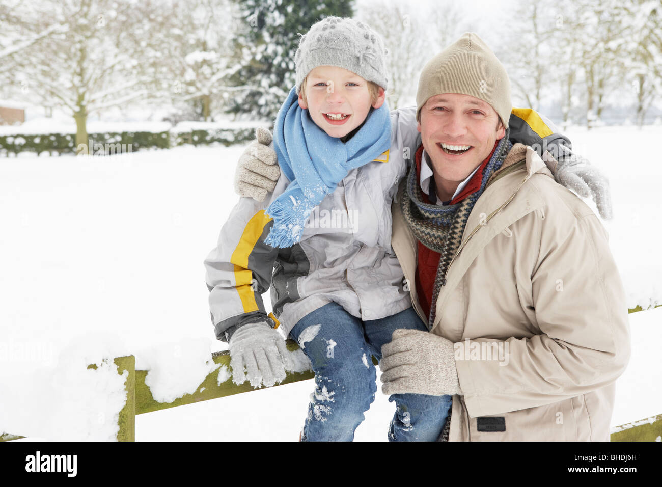 Father And Son Standing Outside In Snowy Landscape Stock Photo - Alamy