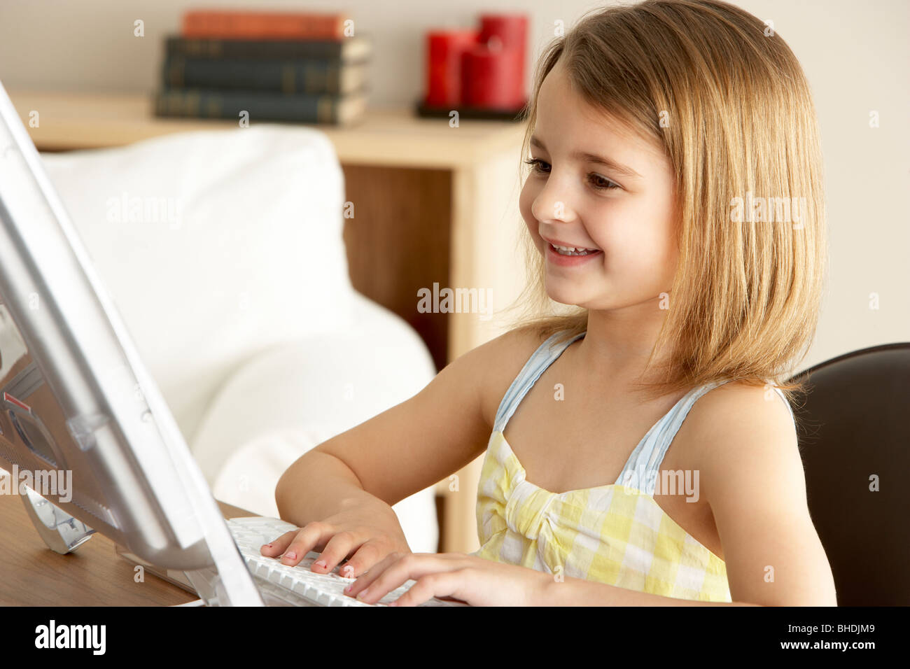 Young Girl Using Computer At Home Stock Photo - Alamy
