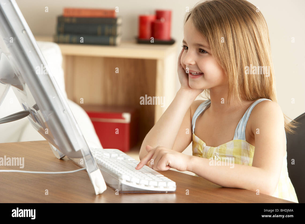 Young Girl Using Computer At Home Stock Photo - Alamy