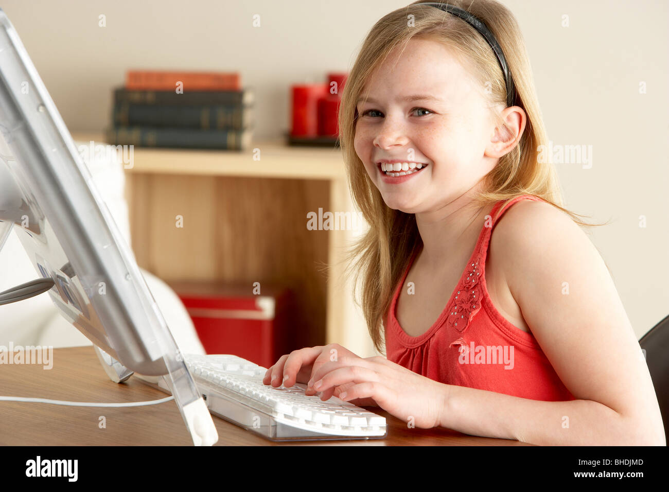 Young Girl Using Computer At Home Stock Photo - Alamy