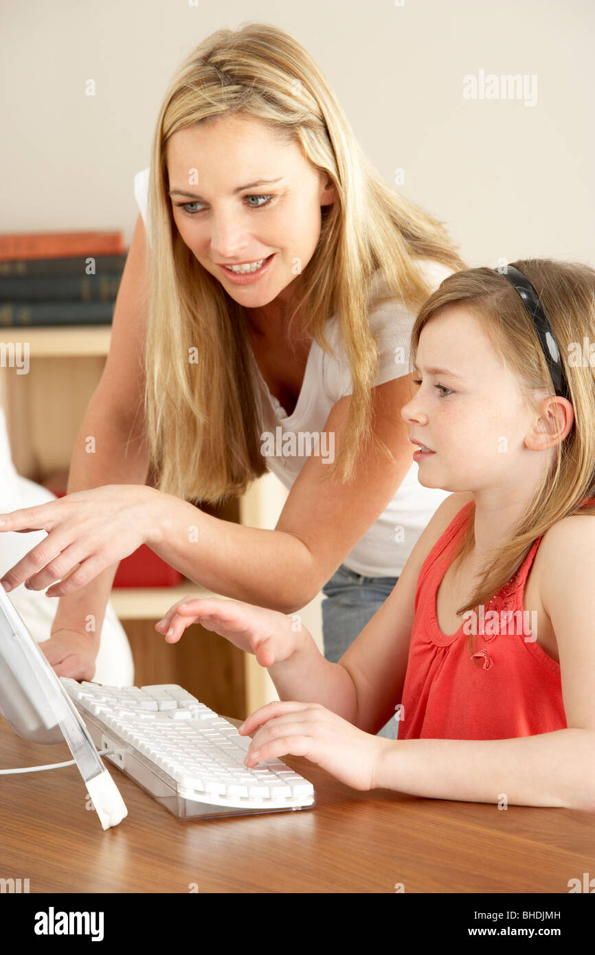 Mother And Daughter At Home Using Computer Stock Photo - Alamy