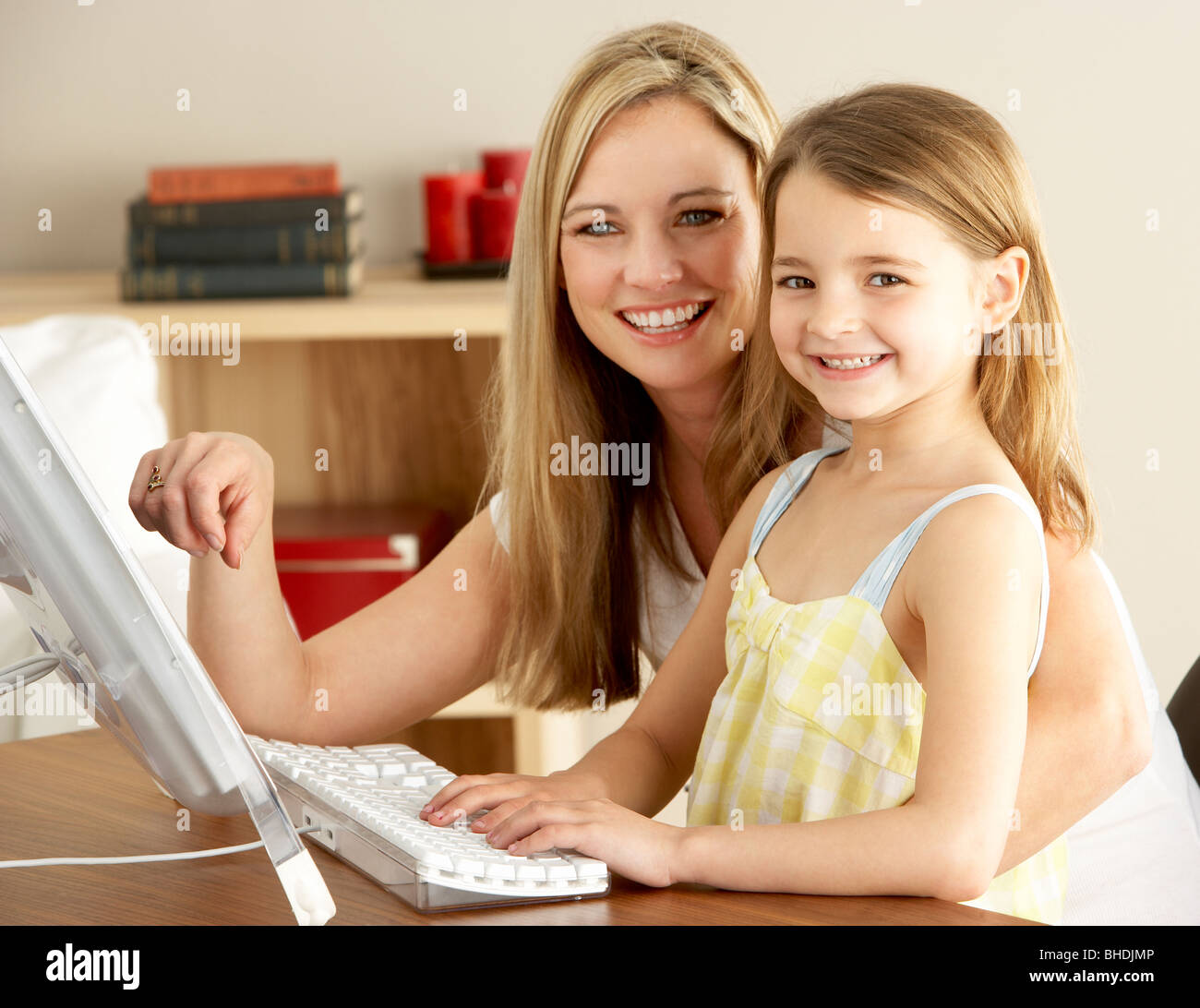 Mother And Daughter At Home Using Computer Stock Photo - Alamy