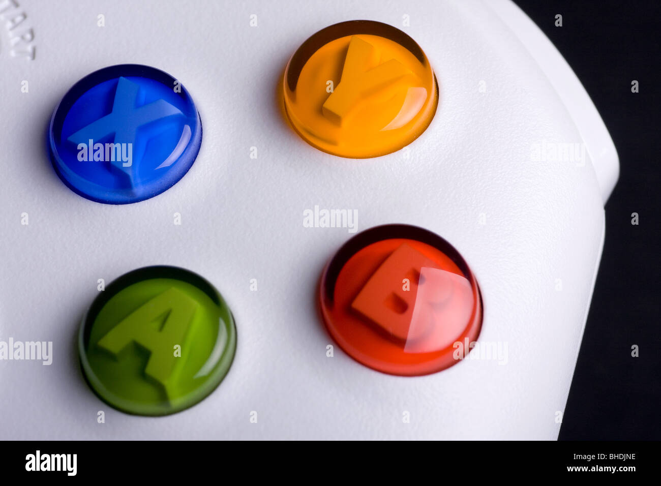 Xbox 360 controller main XYAB button on a black background - close-up ...