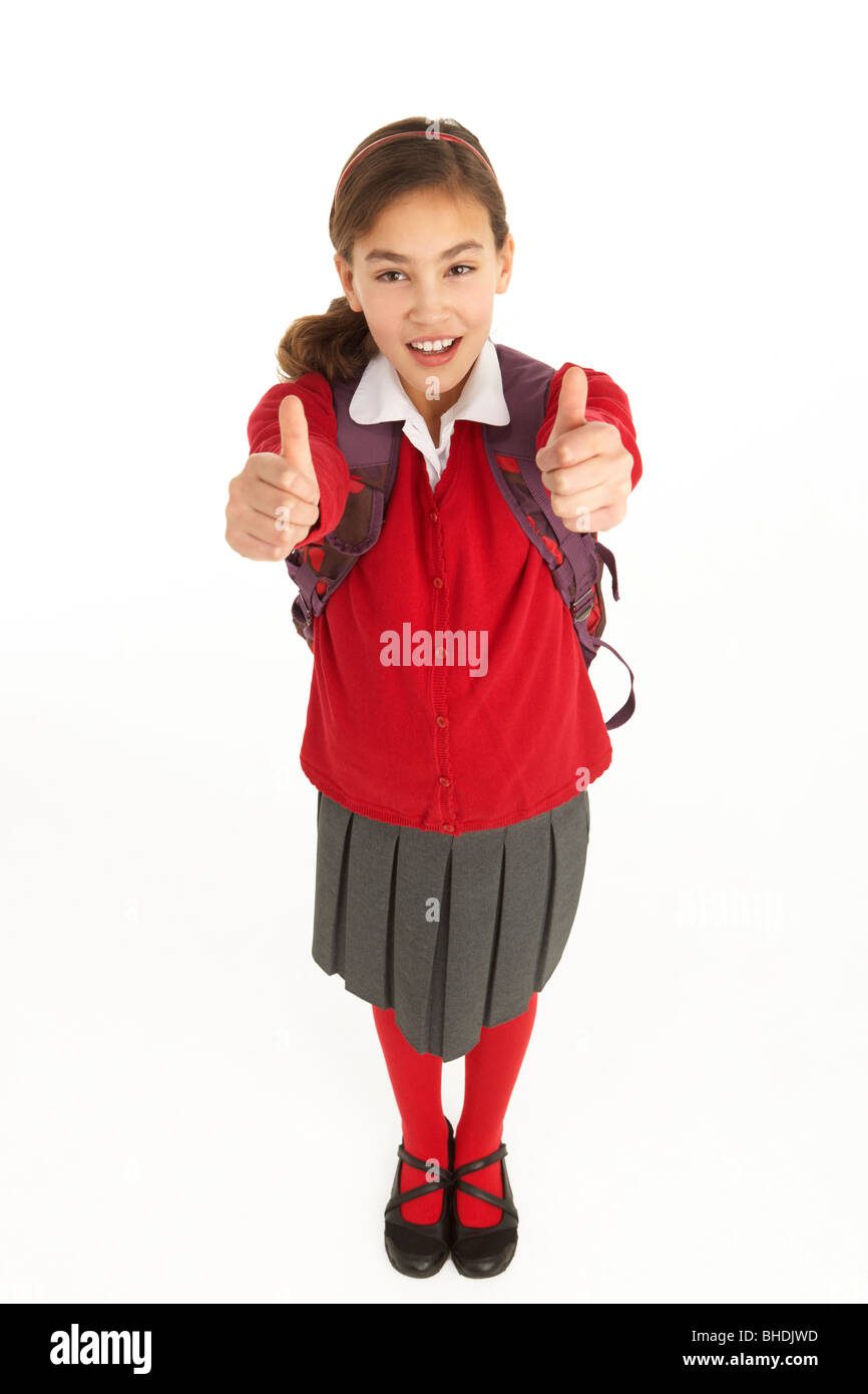 Studio Portrait Of Female Student In Uniform With Backpack Stock Photo ...