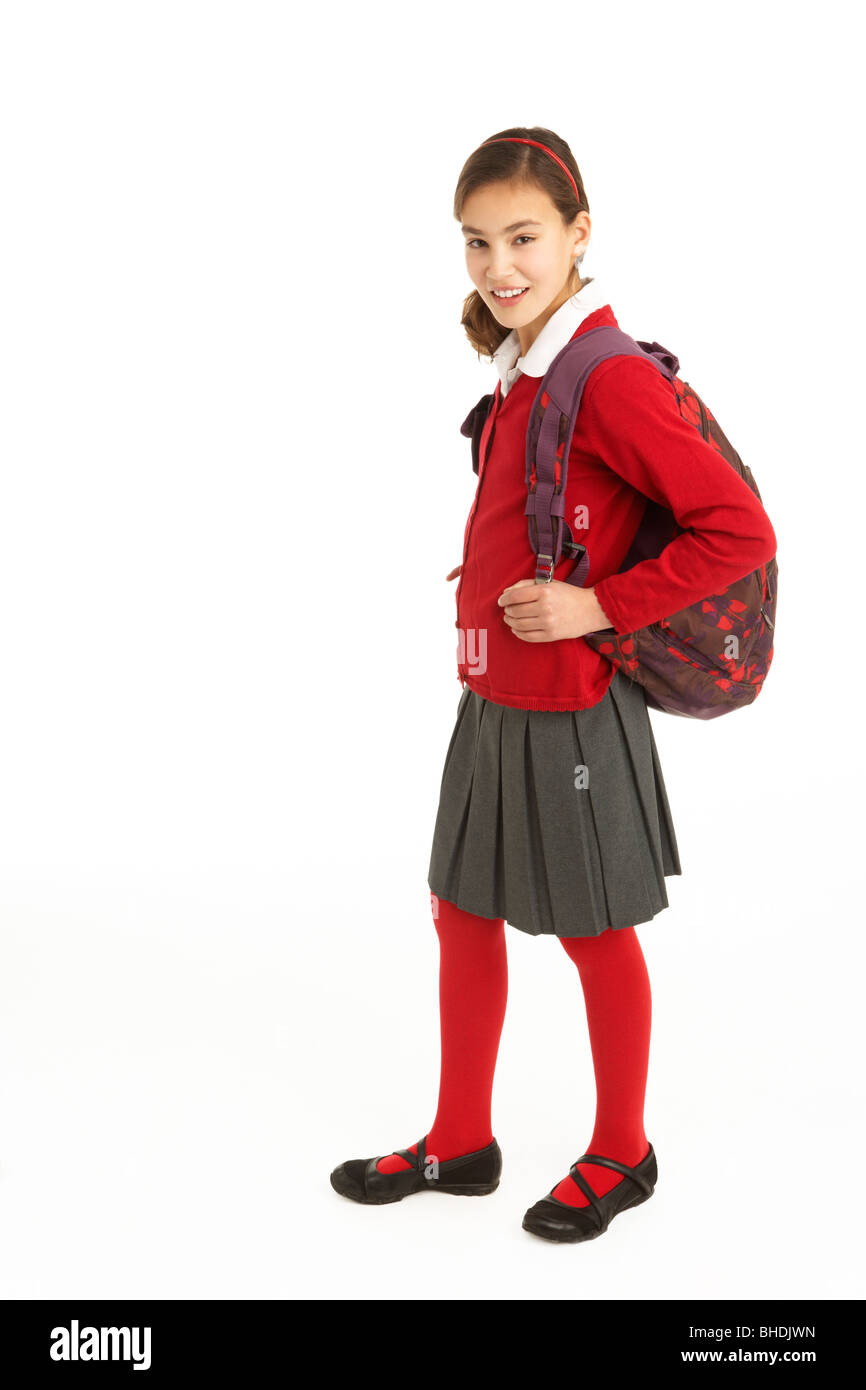 Studio Portrait Of Female Student In Uniform With Backpack Stock Photo ...