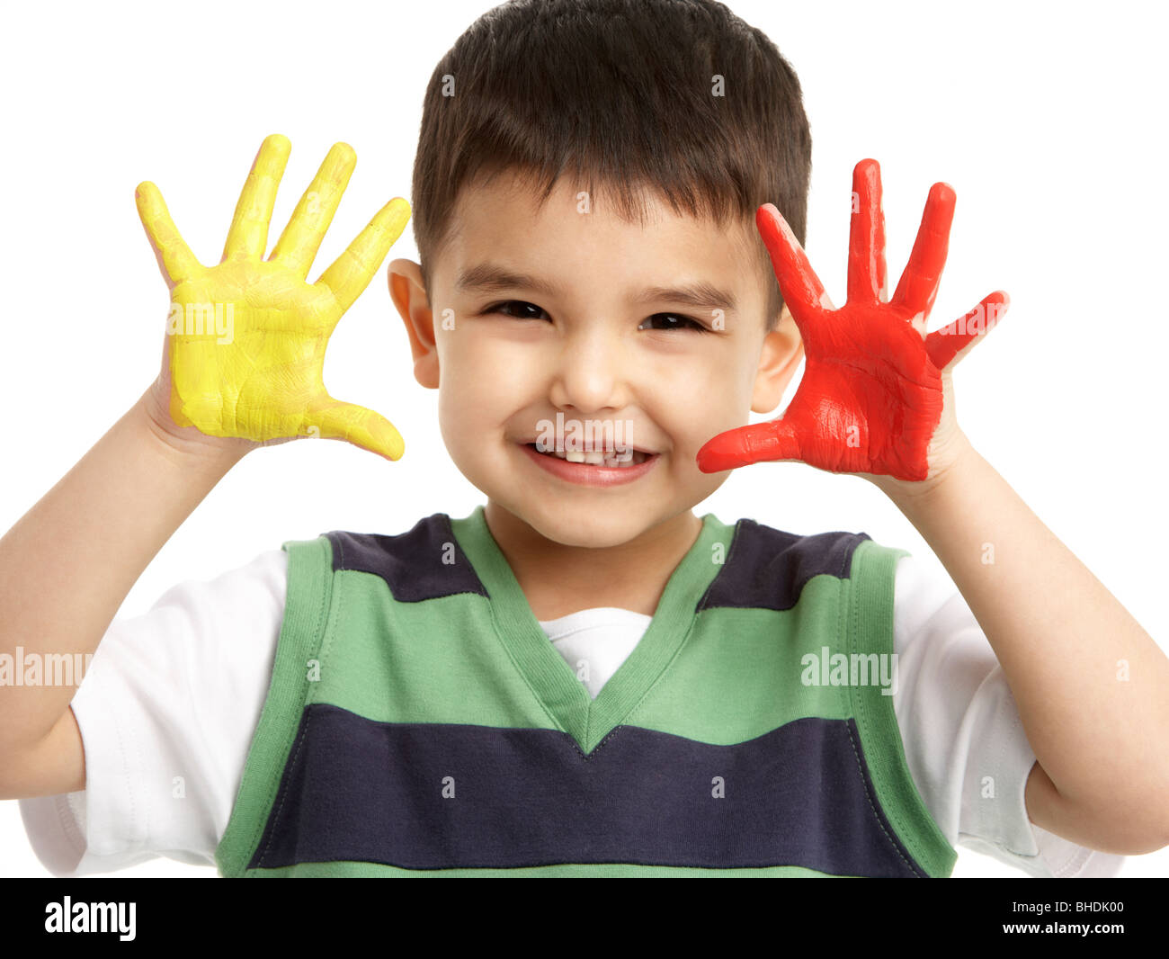 Studio Portrait Of Young Boy With Painted Hands Stock Photo - Alamy
