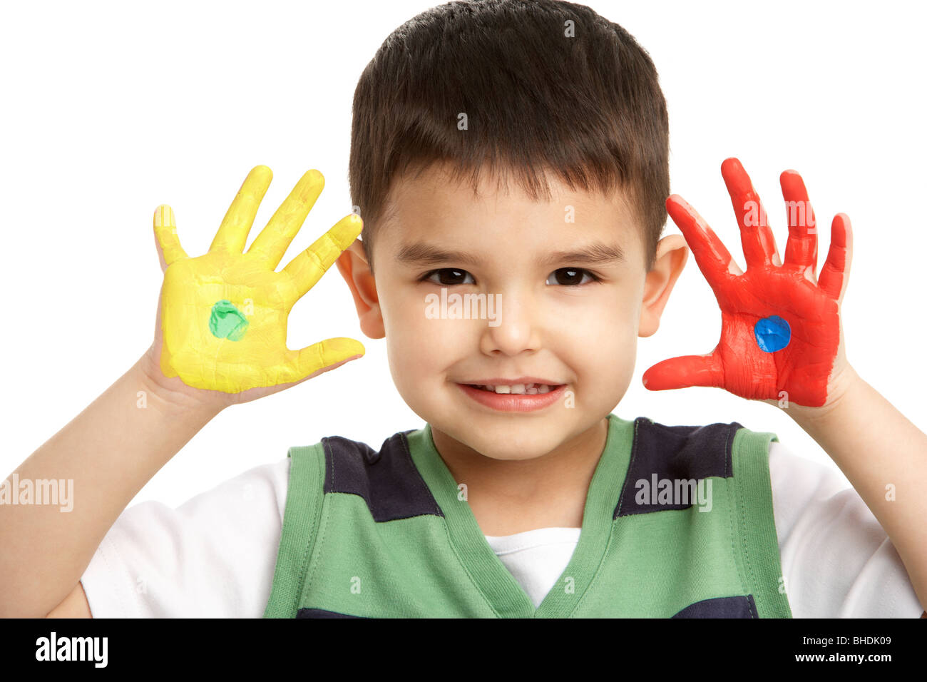 Studio Portrait Of Young Boy With Painted Hands Stock Photo - Alamy