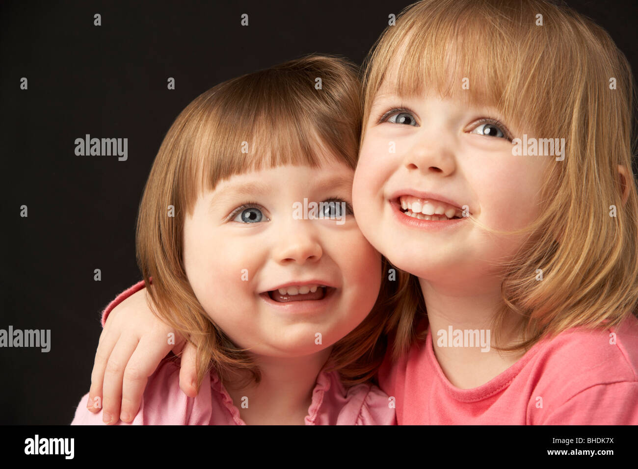 Studio Portrait Of Two Sisters Stock Photo - Alamy
