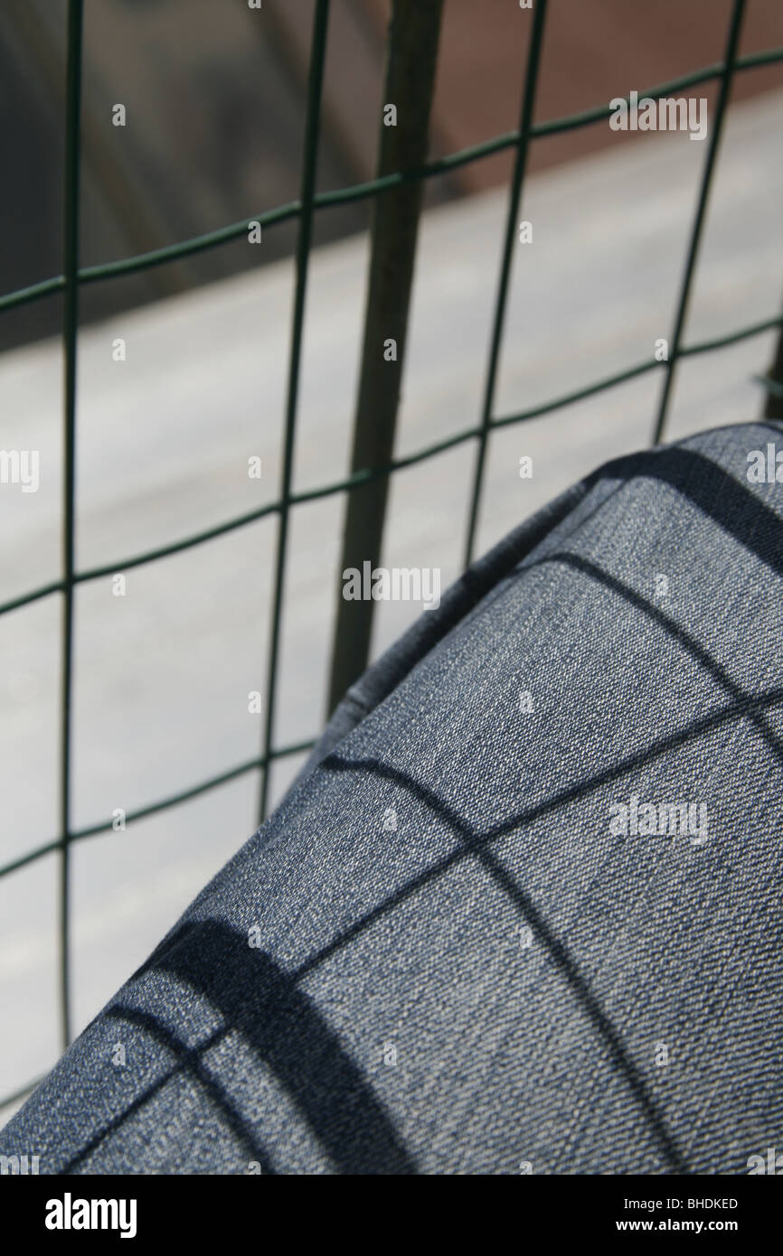 person sitting on terrace in inner city urban scene Stock Photo - Alamy