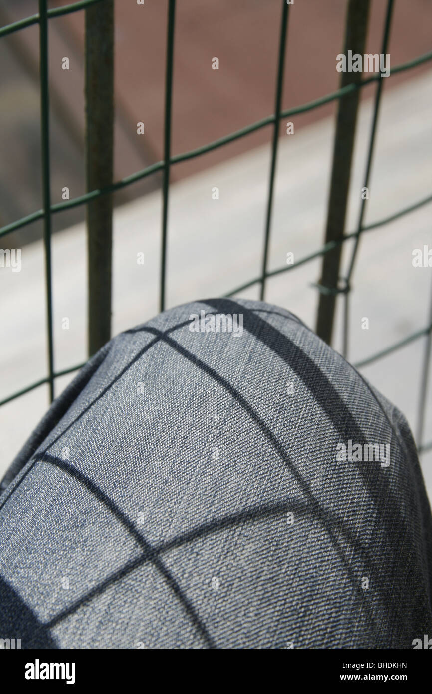 person sitting on terrace in inner city urban scene Stock Photo - Alamy