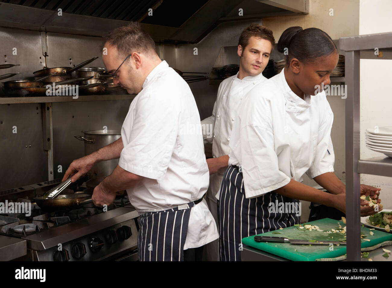Team working together chefs hi-res stock photography and images - Alamy