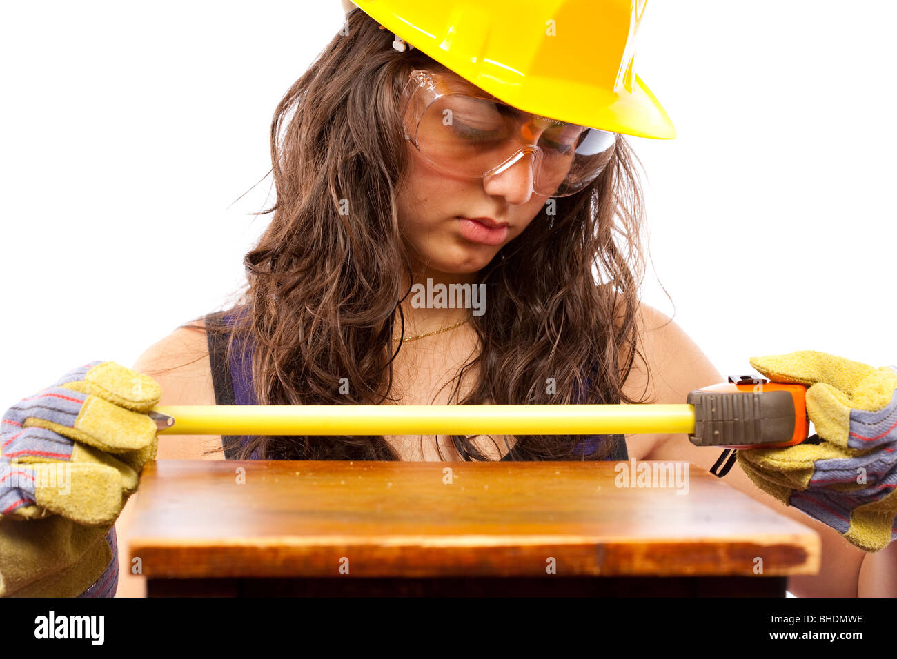 Beautiful latino construction worker woman isolated on white background ...