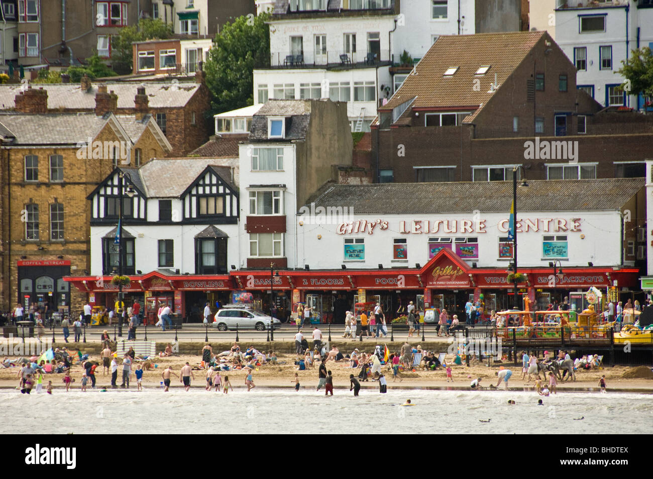 Seafront shops and amusement arcades with sea and beach in the ...