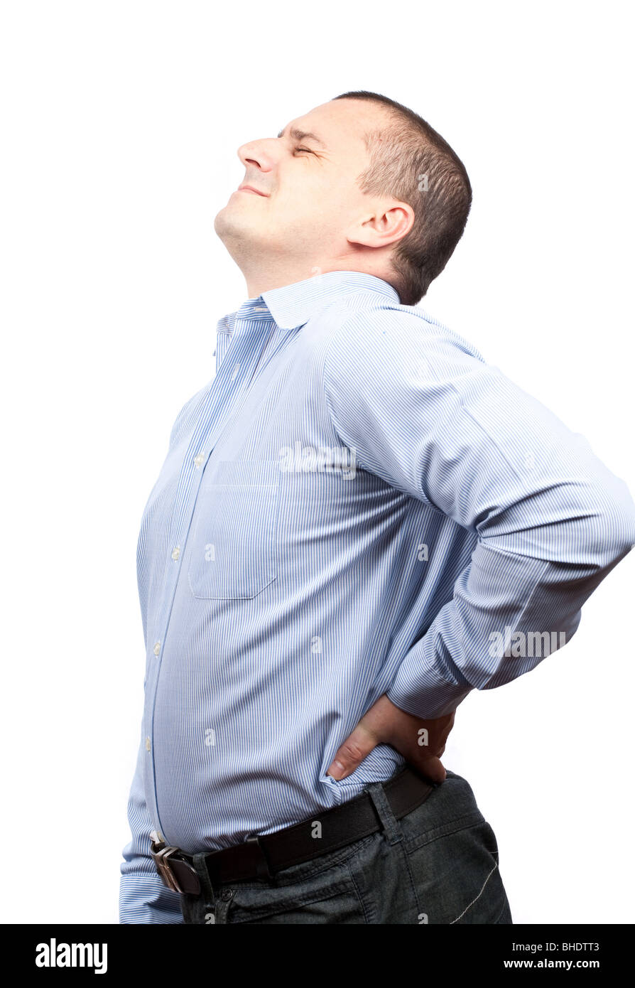 Young businessman with strong back pain, isolated on white background ...