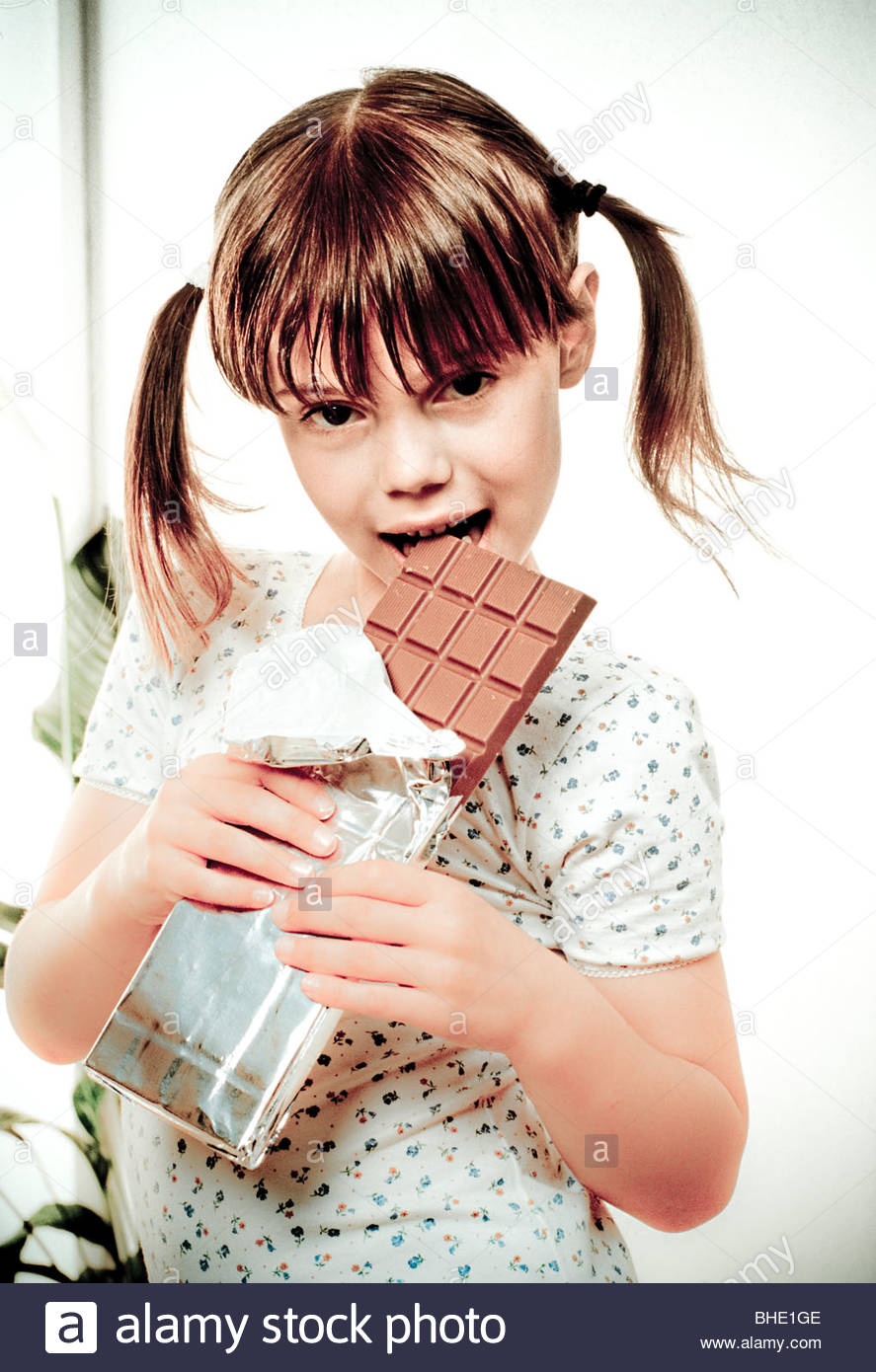 Children Eating Chocolate Bars Stock Photos & Children Eating Chocolate ...