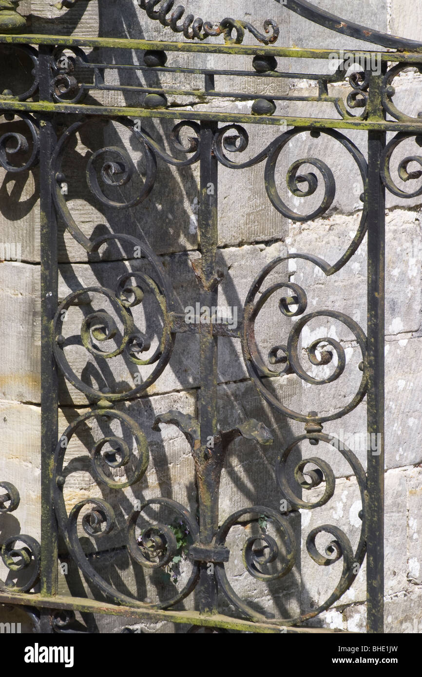 Close up of an old ornate English iron garden gate Stock Photo - Alamy