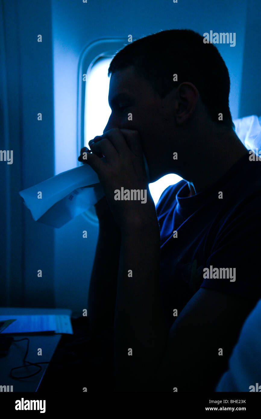 person with airsickness in a plane Stock Photo - Alamy