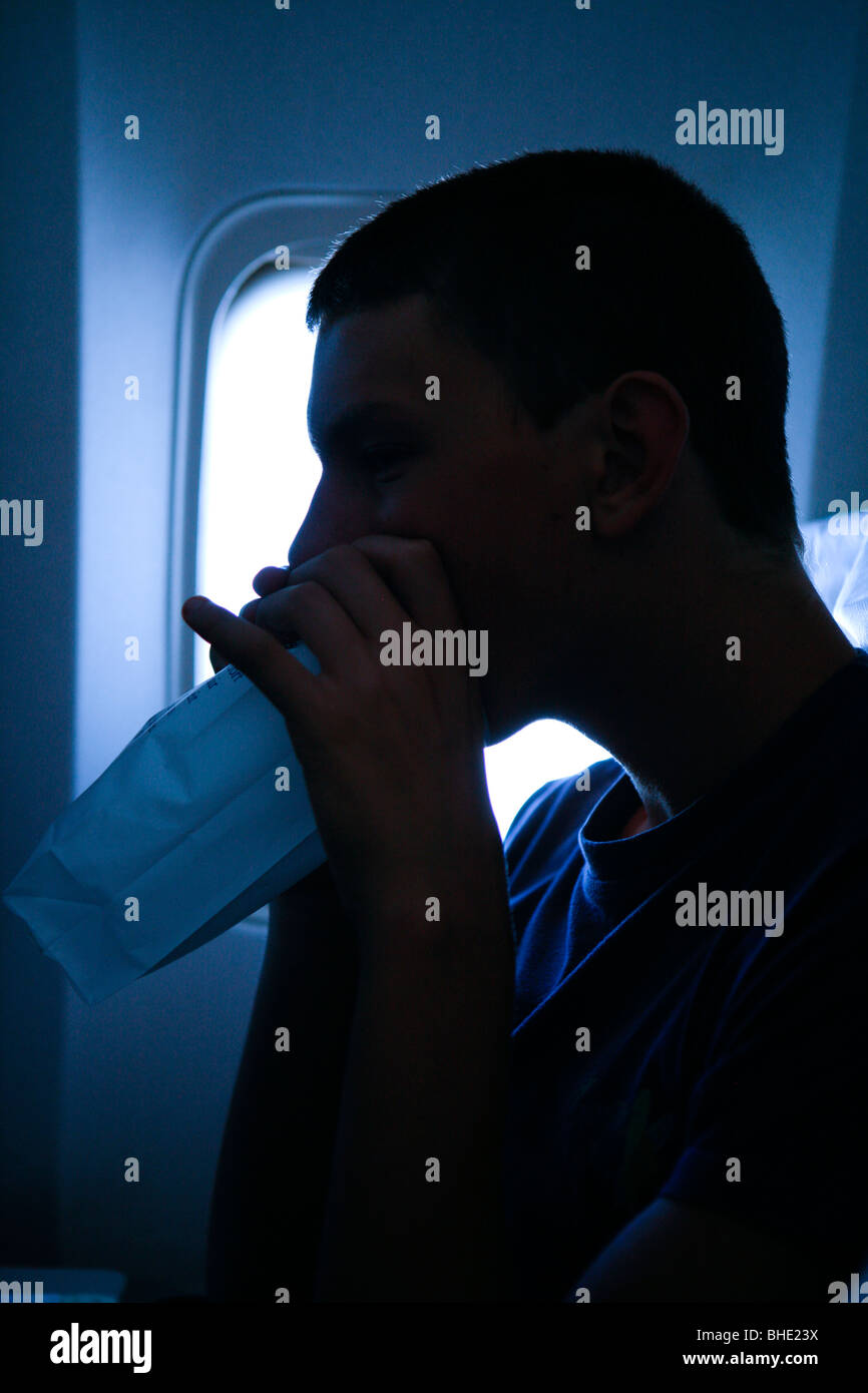 person with airsickness in a plane Stock Photo - Alamy