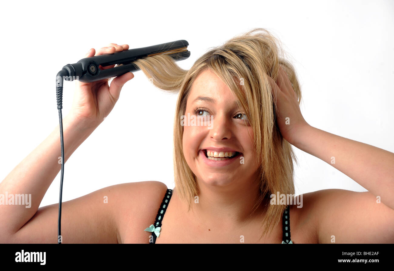 Female hair tongs hi-res stock photography and images - Alamy