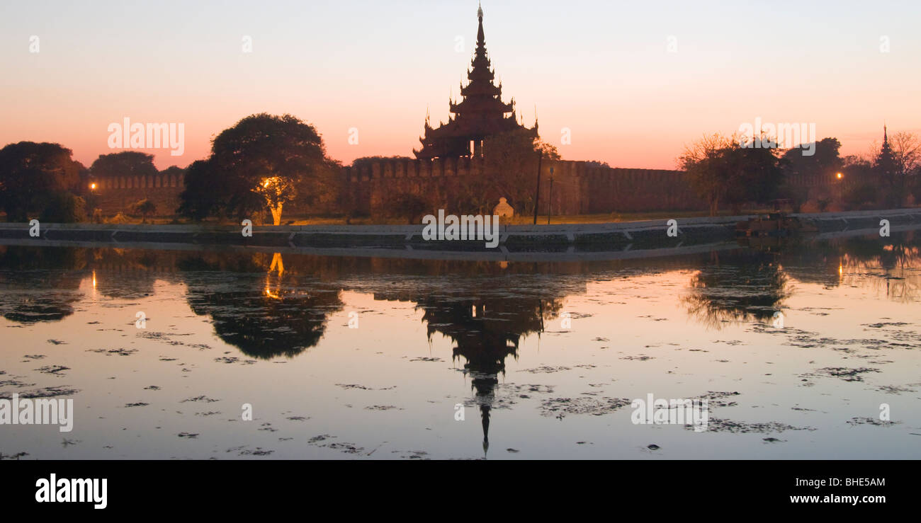Sunset over the channel surrounding the Royal Palace, Mandalay, Burma ...