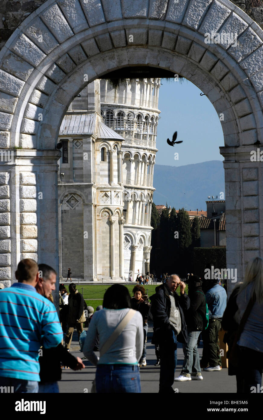 Leaning Tower of Pisa in Pisa Tuscany Italy seen through arch in wall ...