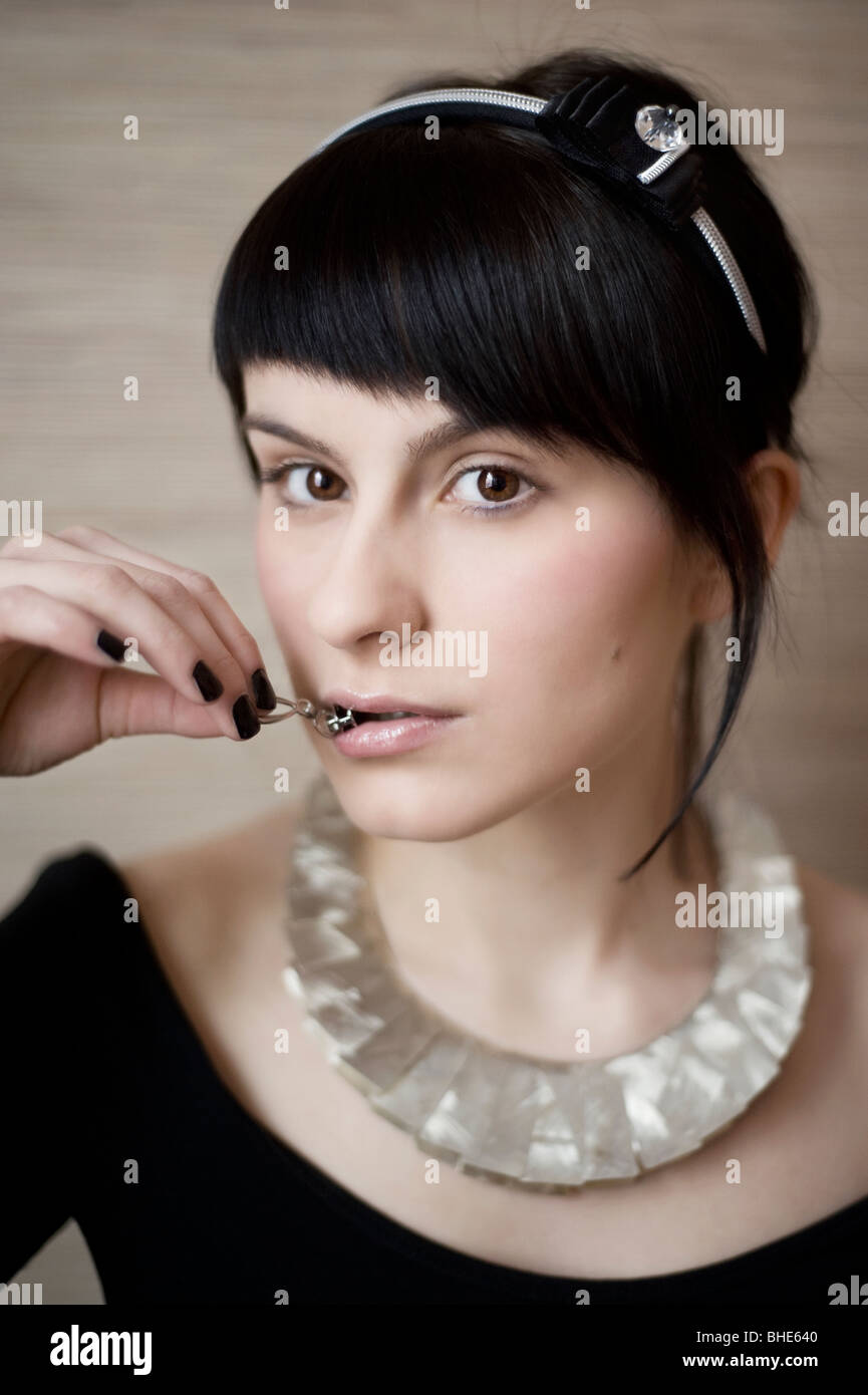 artistic portrait of a young woman with zipper Stock Photo - Alamy