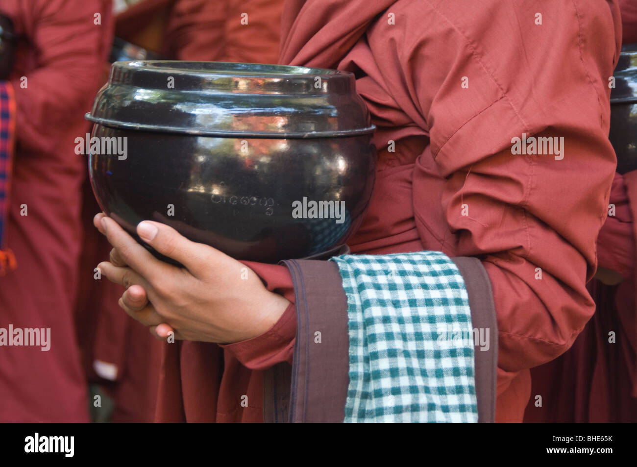 Monk carrying bowl of rice hi-res stock photography and images - Alamy