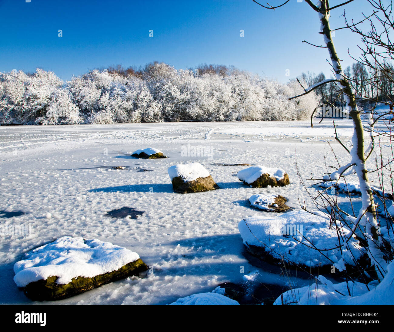 The frozen waters of a small lake known as Liden Lagoon in Swindon ...