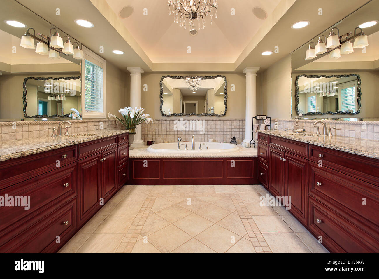 Master bath in luxury home with white columns Stock Photo - Alamy