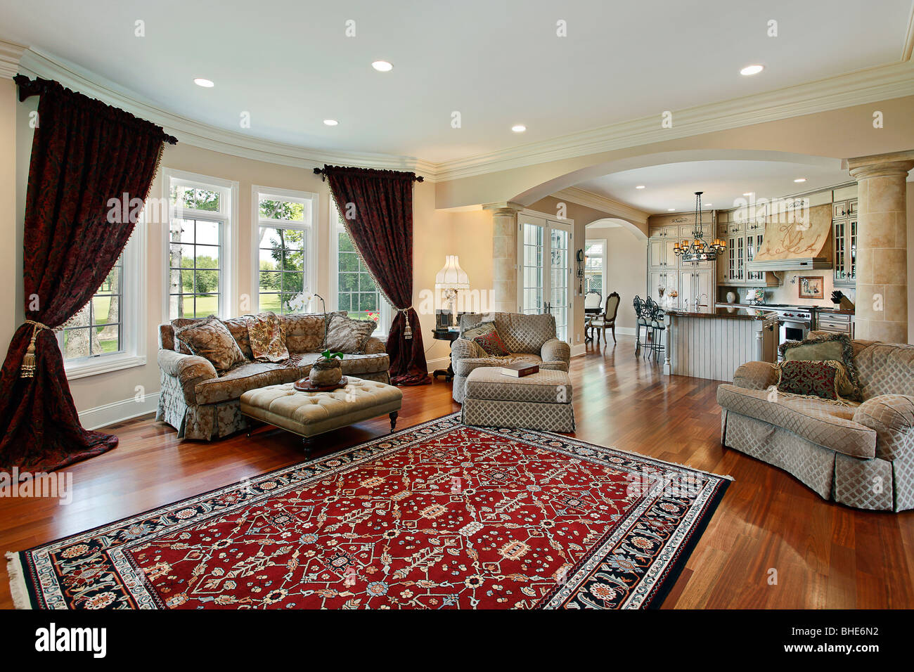 Living room in luxury home with two columns Stock Photo - Alamy