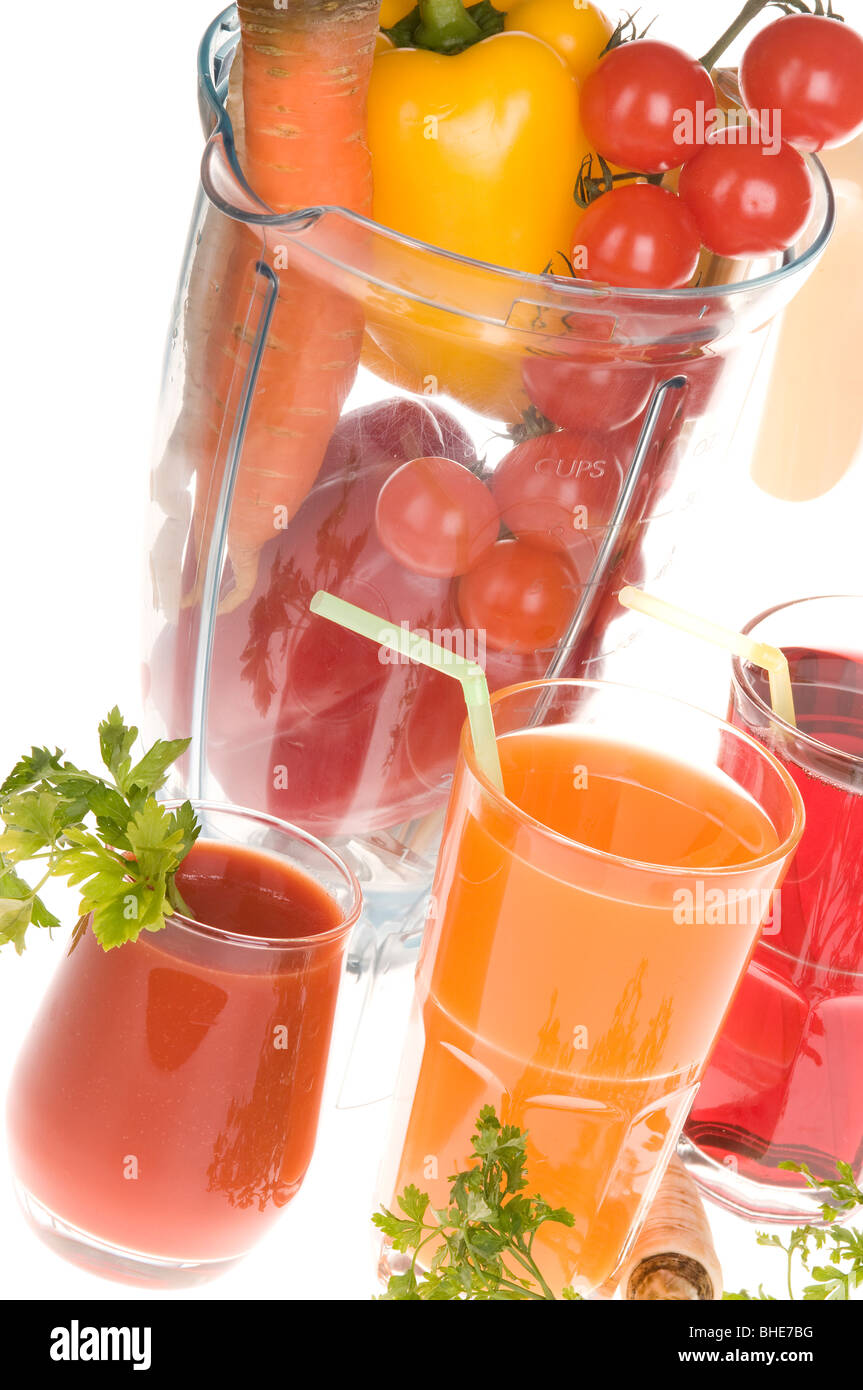 Fresh vegetable food in blender and juice over white background Stock ...