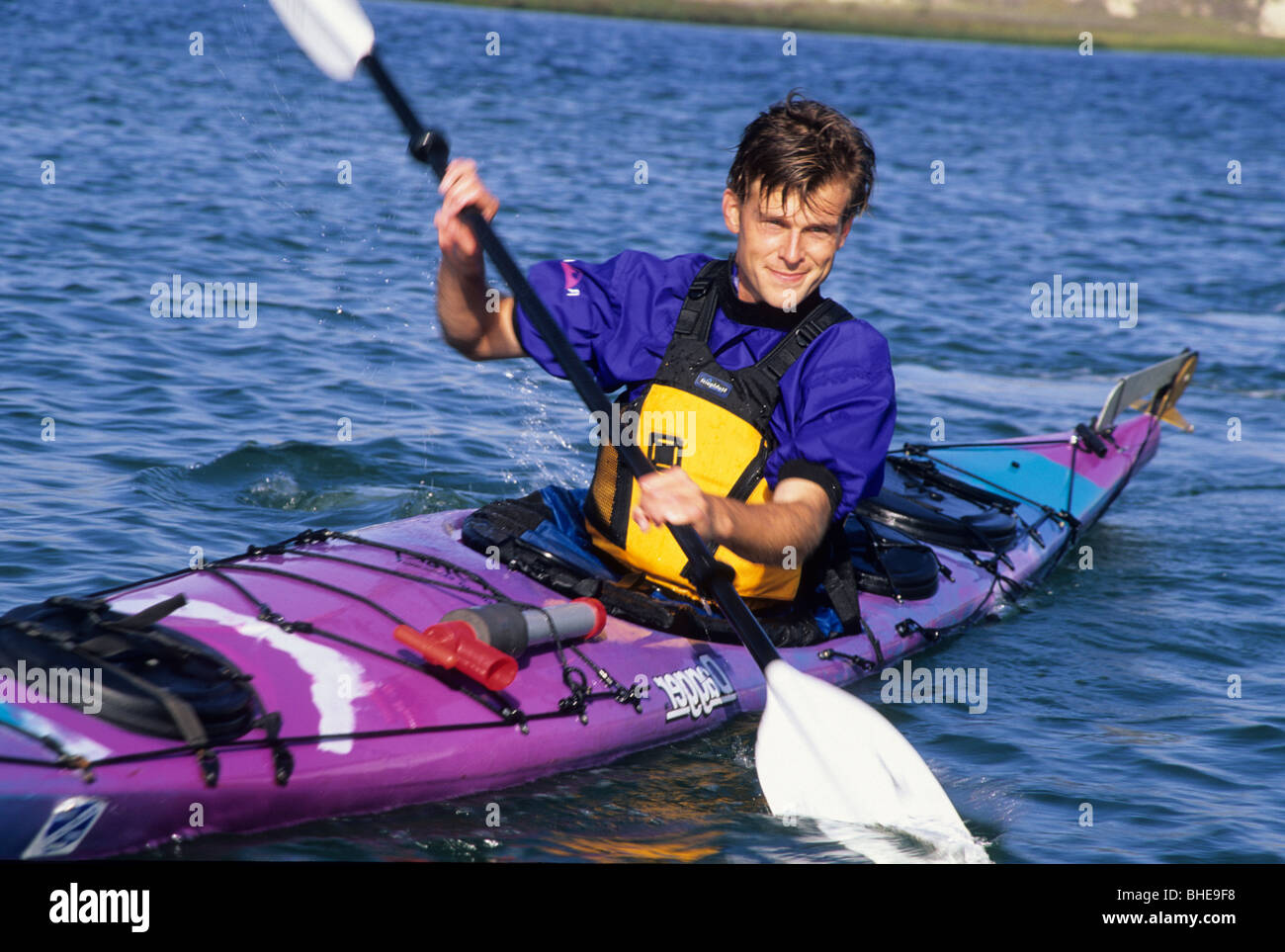 Man sea kayaking Stock Photo - Alamy