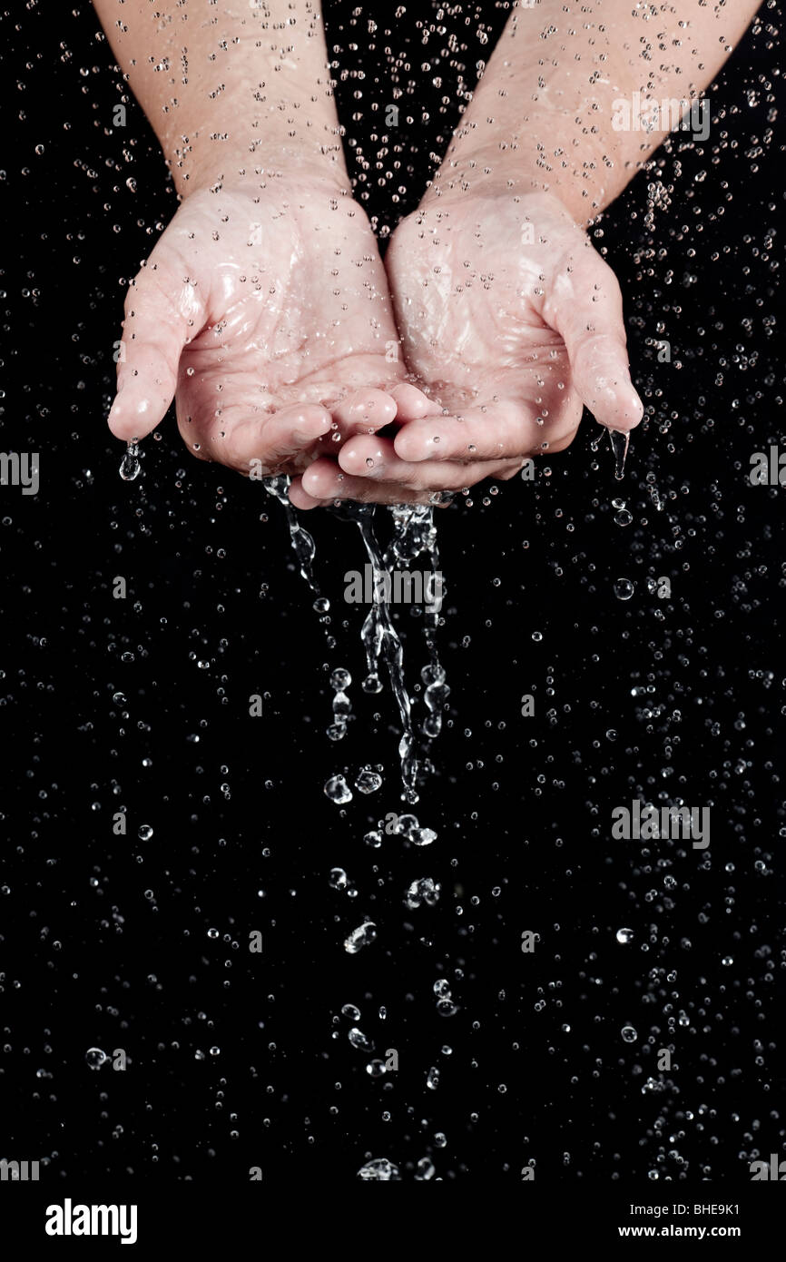 Water in palms of hands Stock Photo - Alamy