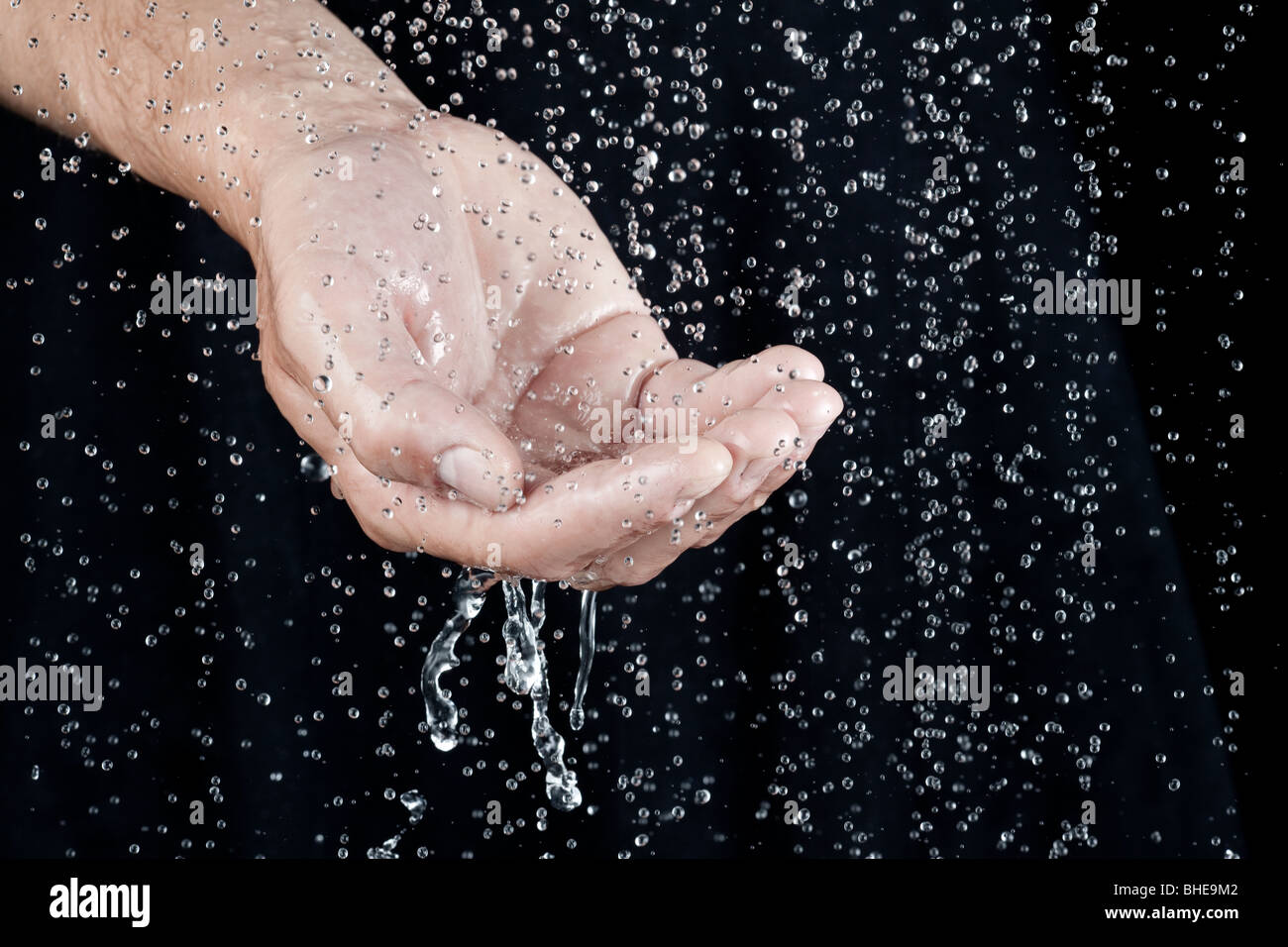 Water in palms of hands Stock Photo - Alamy