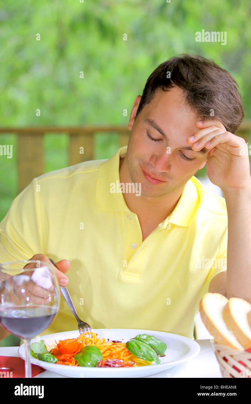 Man eating noodle unhappy hi-res stock photography and images - Alamy