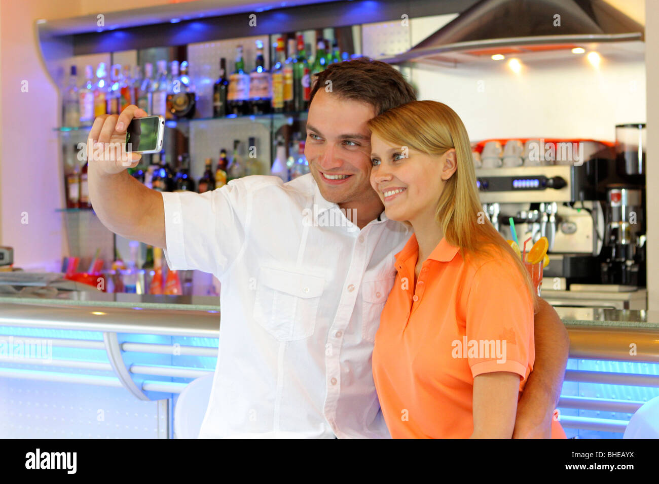 Two men bar friends phone hi-res stock photography and images - Alamy