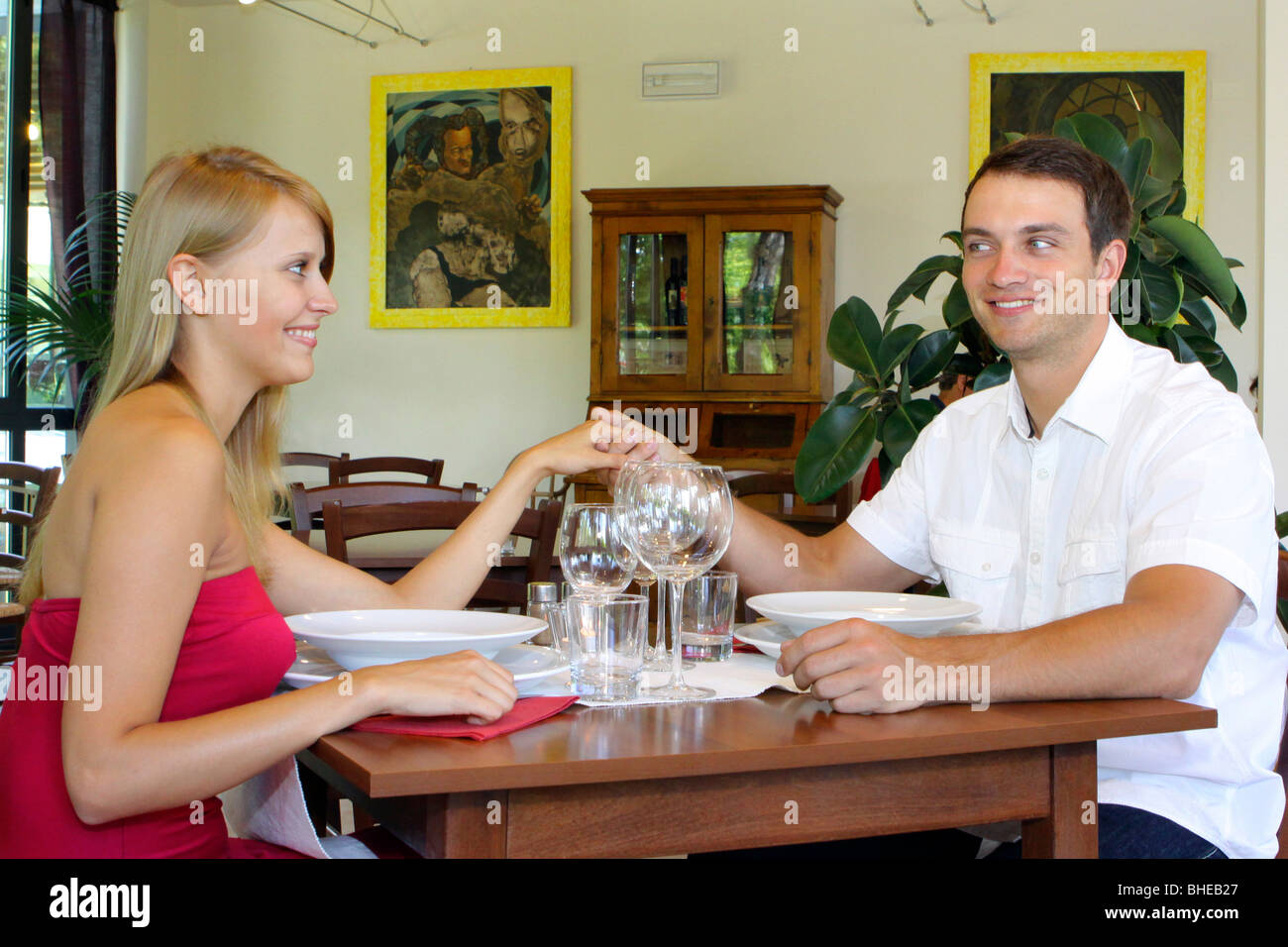 Couple in love in a restaurant Stock Photo - Alamy